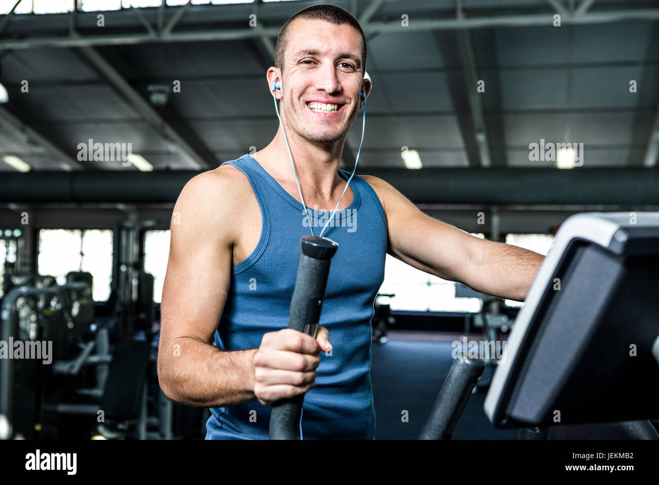Smiling man working out with headphones on Stock Photo - Alamy