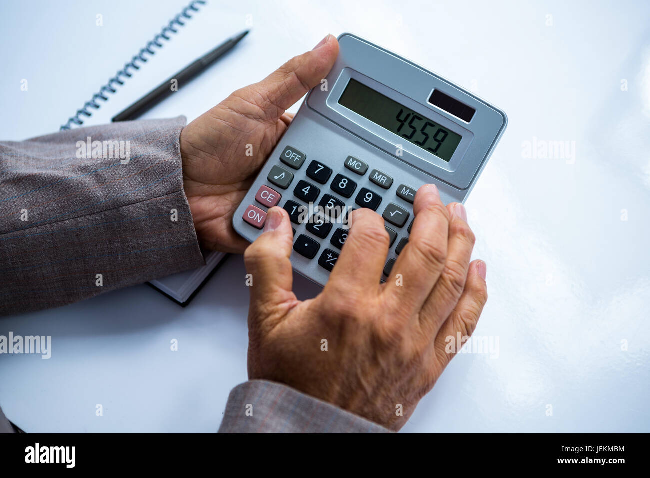 Businessman hand holding using calculator hi-res stock photography and ...