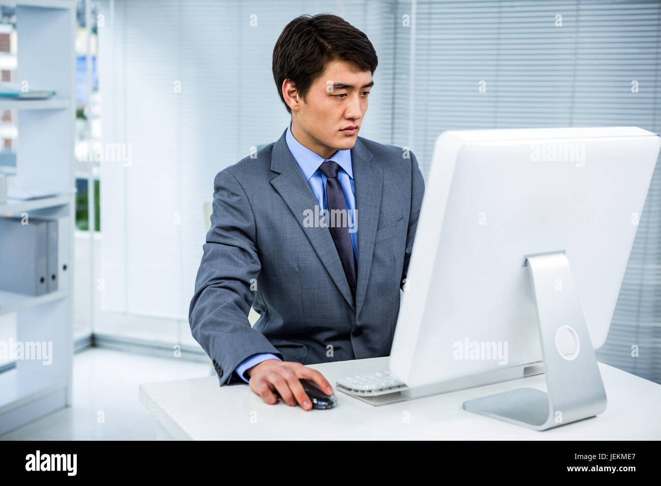 Businessman using his computer Stock Photo - Alamy