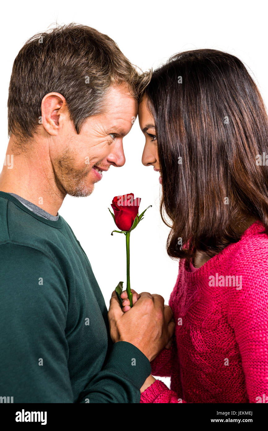 Happy couple with red rose Stock Photo - Alamy