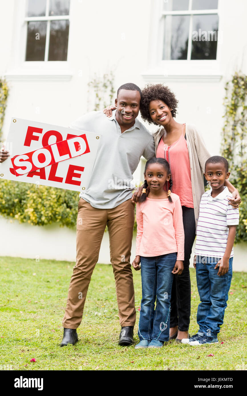 Happy family standing together Stock Photo - Alamy