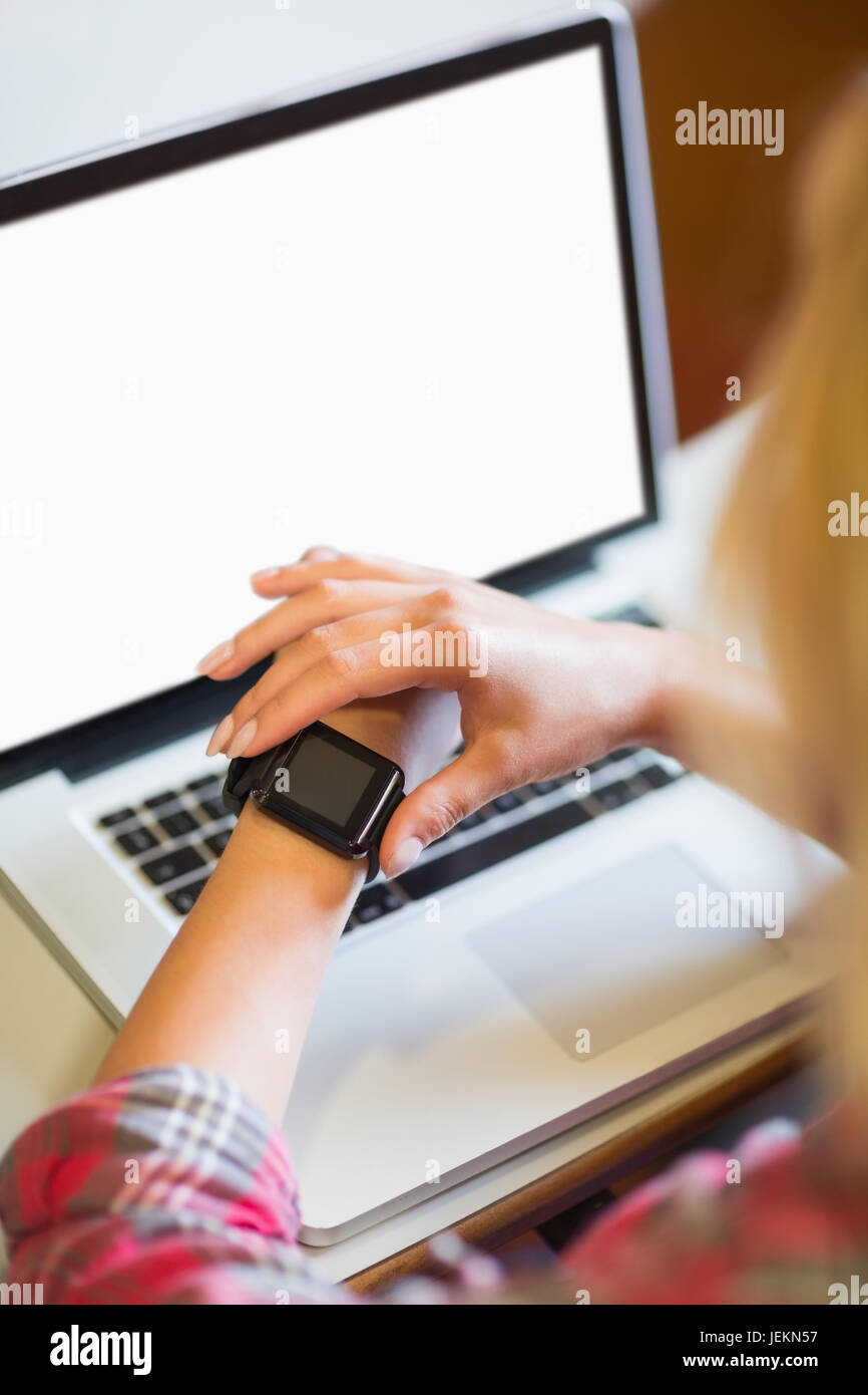 Female student using smart watch Stock Photo - Alamy