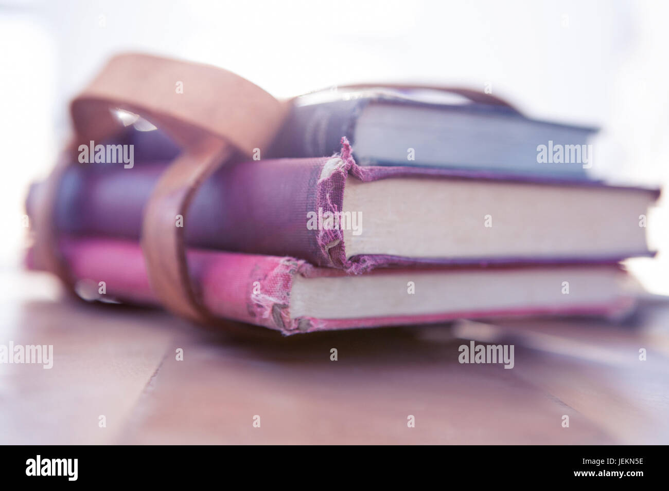 Books on table in office Stock Photo - Alamy