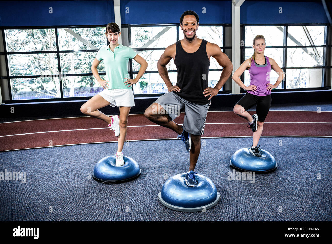 Fit people doing exercise with bosu ball Stock Photo - Alamy