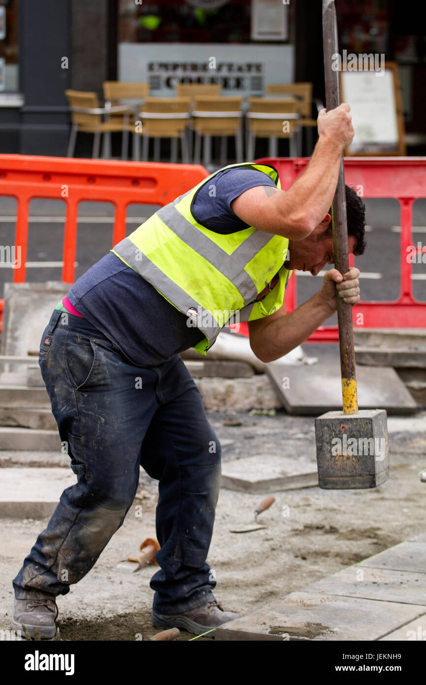 A Workman from the Civil Engineering Company “Land & Building Services ...