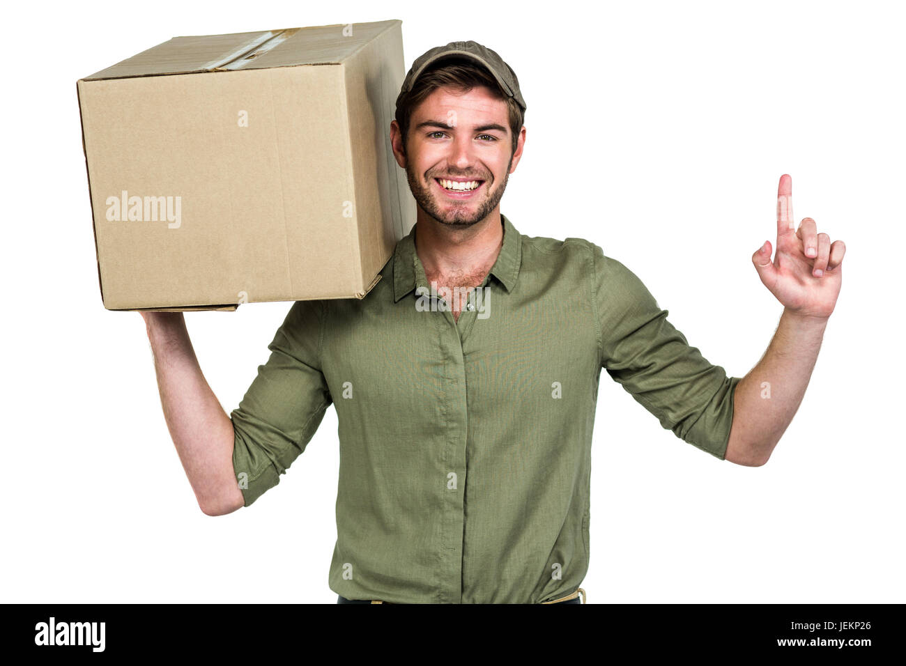Handsome postman holding pack pointing up Stock Photo - Alamy