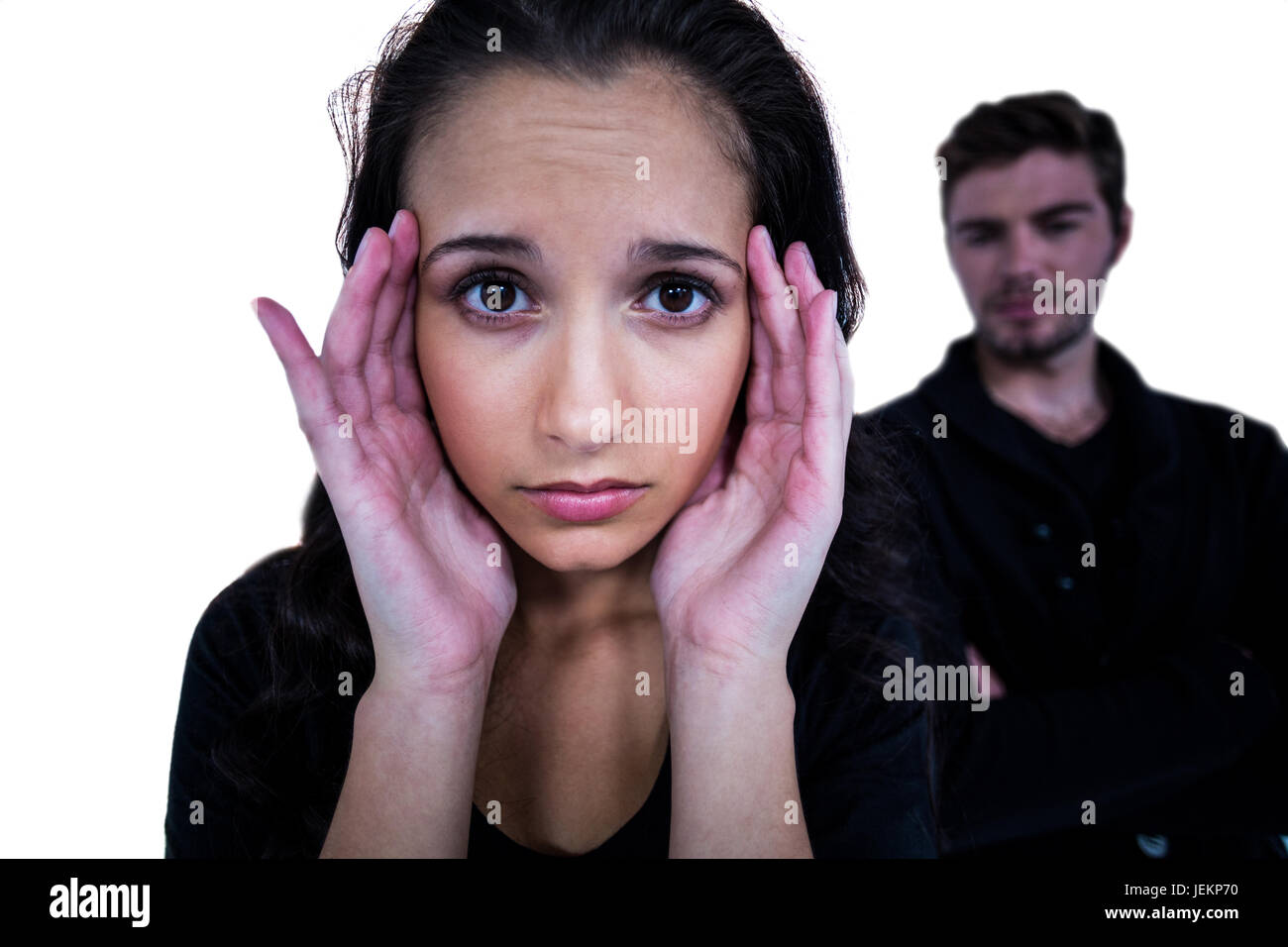 Sad woman looking at camera with sad man Stock Photo - Alamy