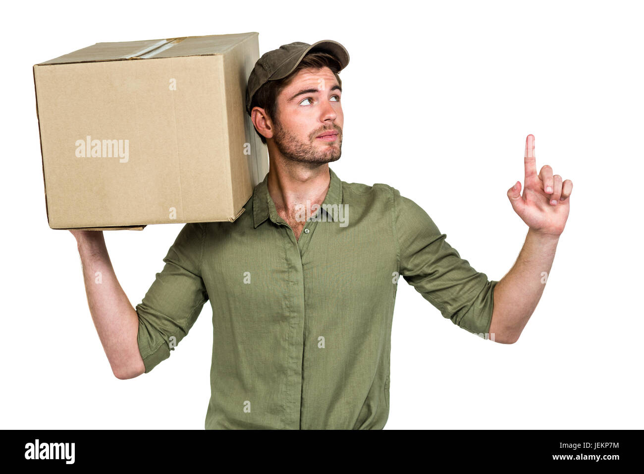 Handsome postman holding pack looking up Stock Photo - Alamy