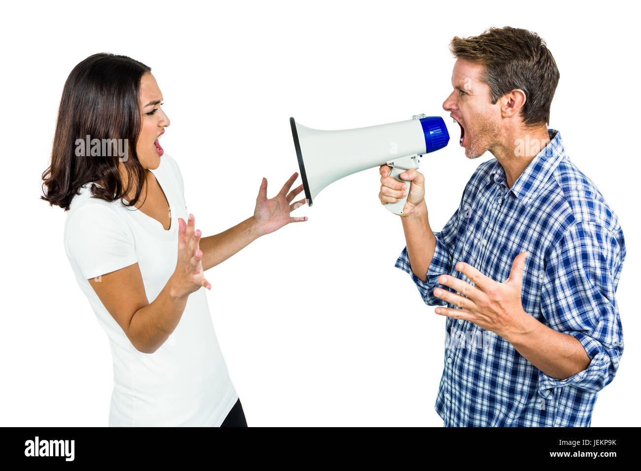 Couple shouting with man holding megaphone Stock Photo - Alamy