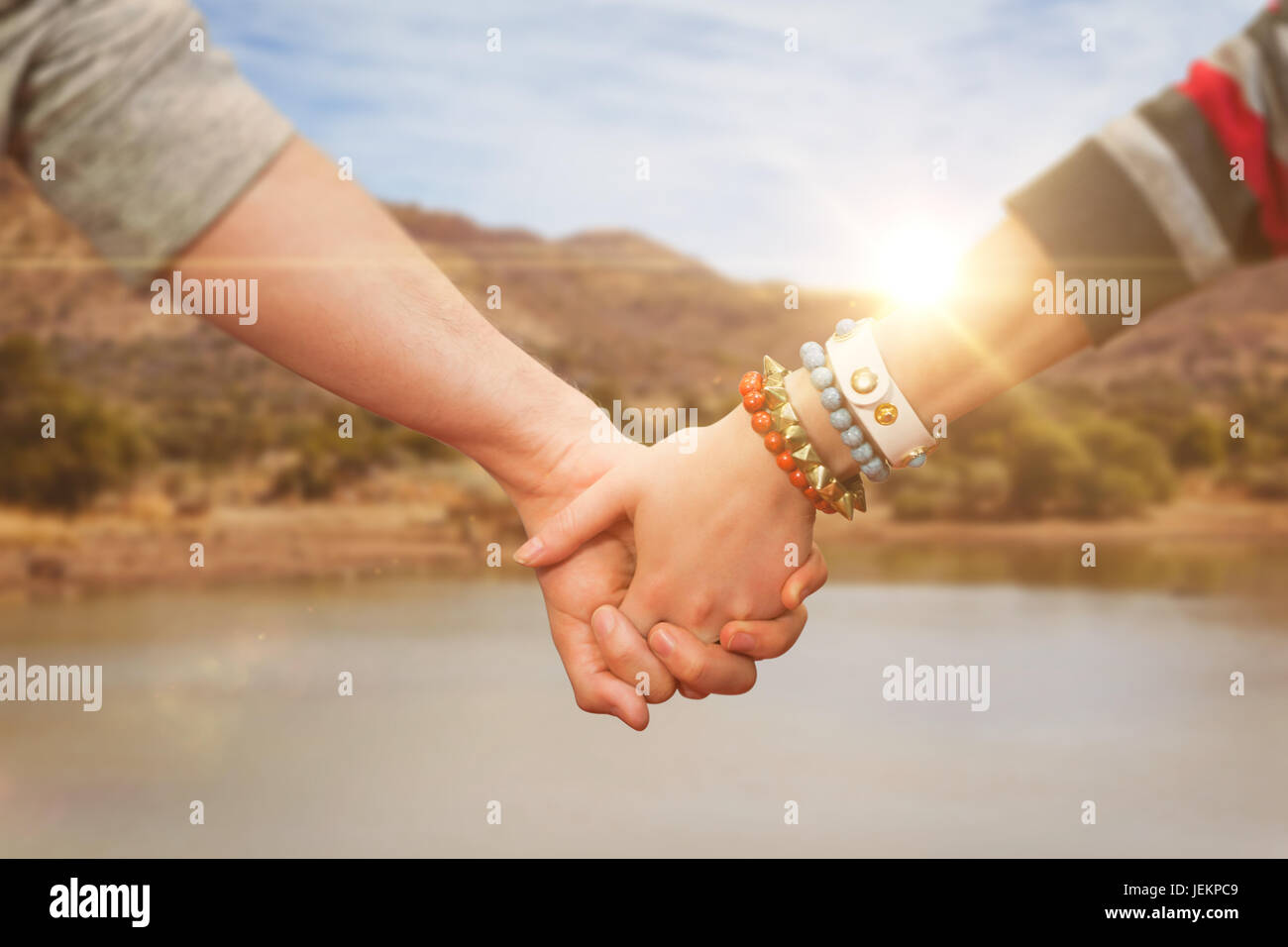 Composite image of students holding hands Stock Photo - Alamy