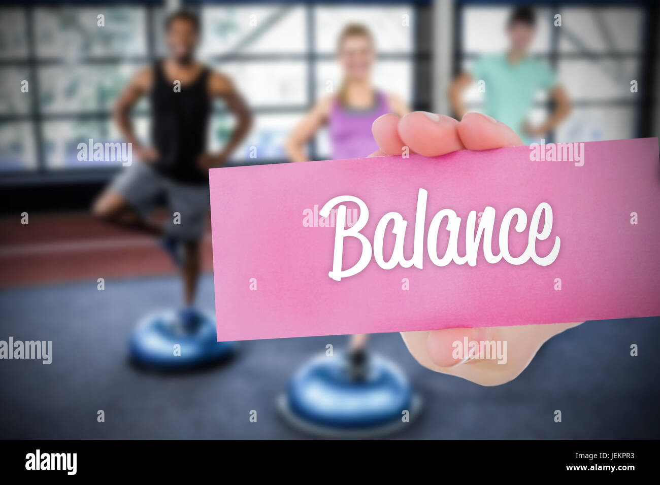 Balance against people background Stock Photo - Alamy