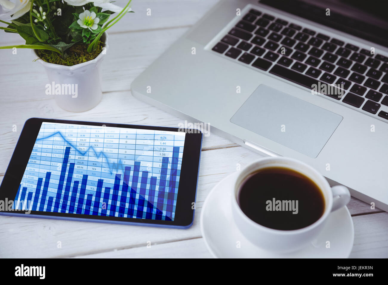 Composite image of tablet on desk Stock Photo - Alamy