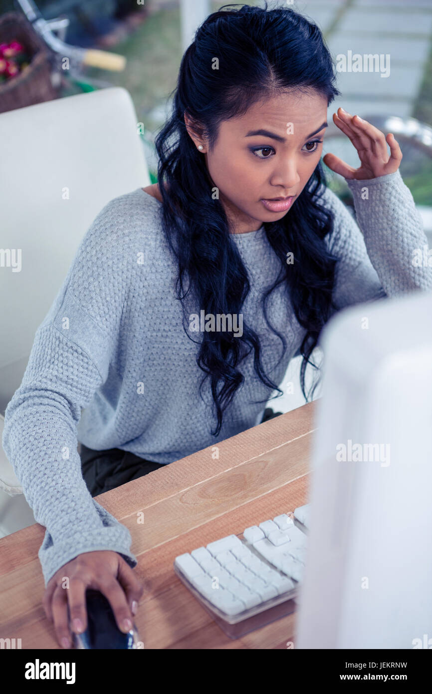 Pretty Asian woman using computer Stock Photo - Alamy