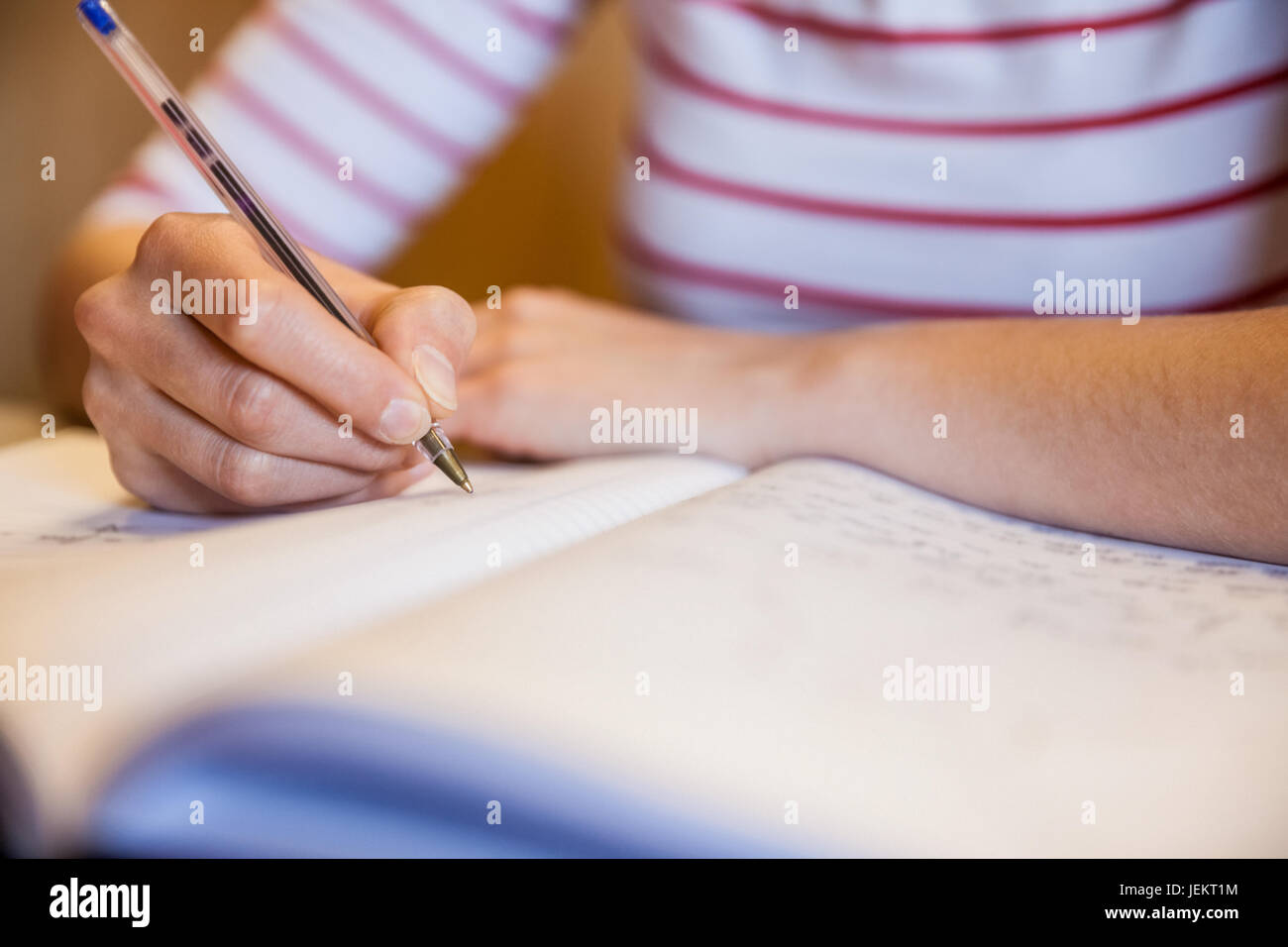 Female student writing notes Stock Photo - Alamy