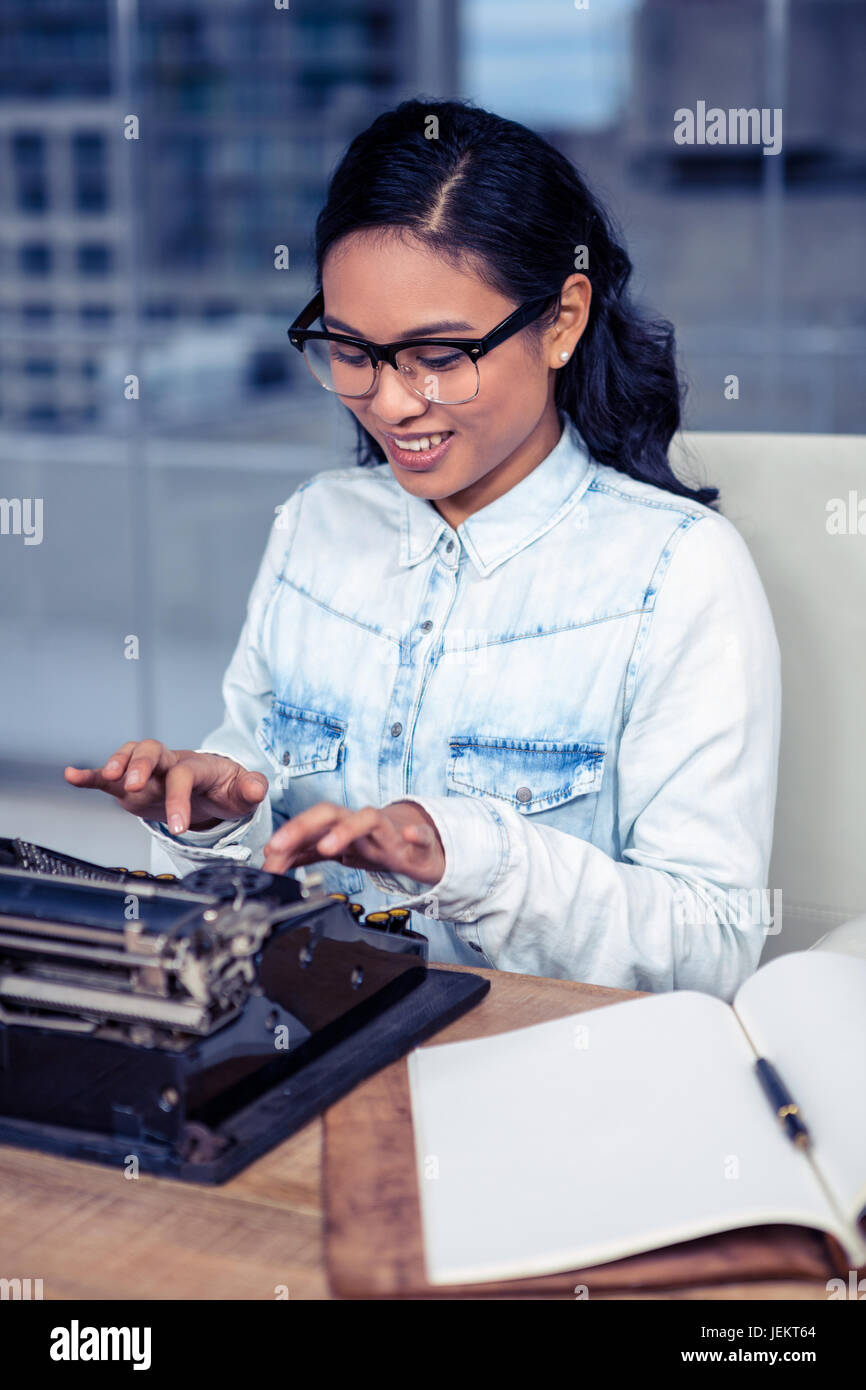Asian woman typewriting Stock Photo - Alamy