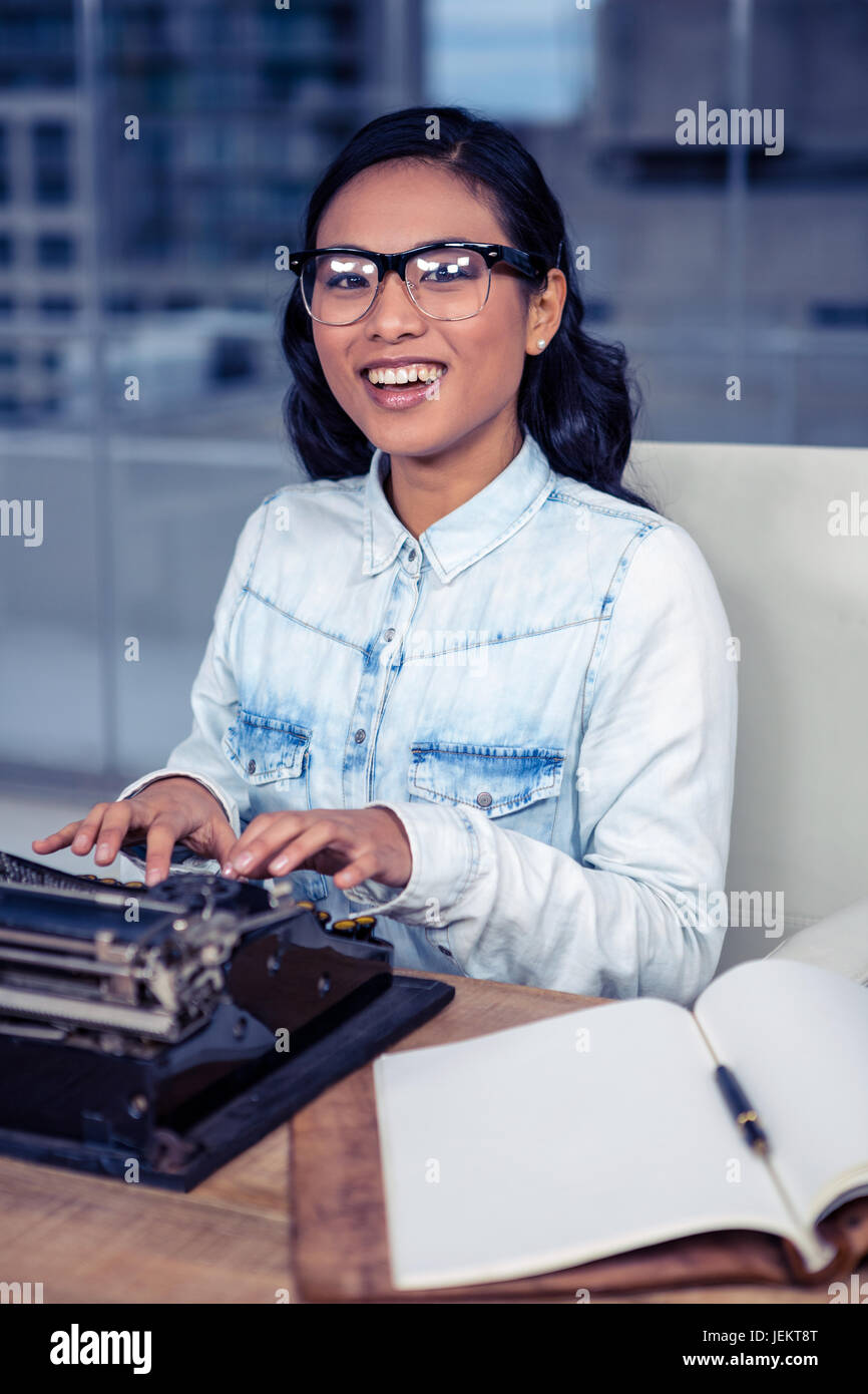 Asian woman typewriting Stock Photo - Alamy