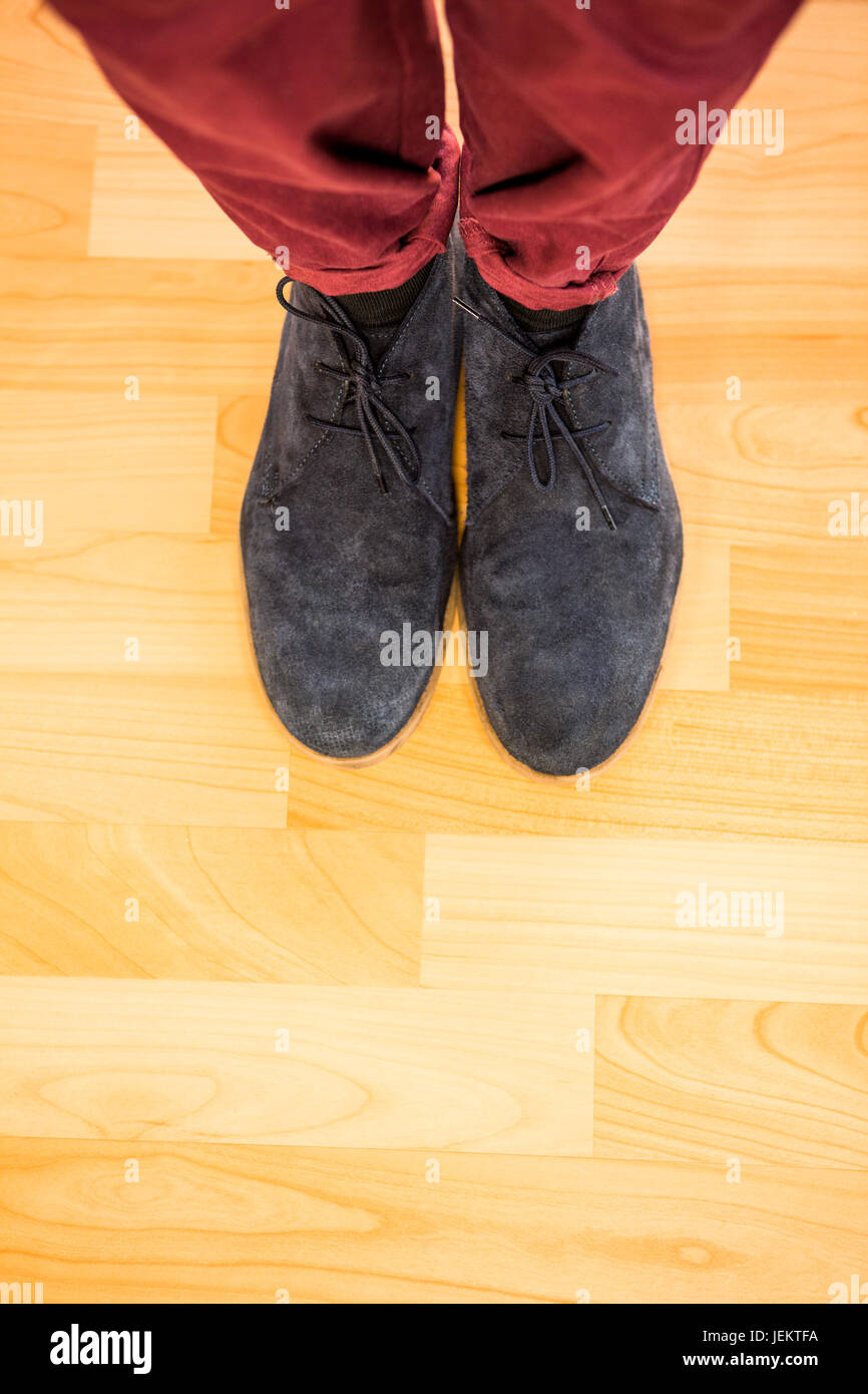 High angle of man wearing boots Stock Photo - Alamy