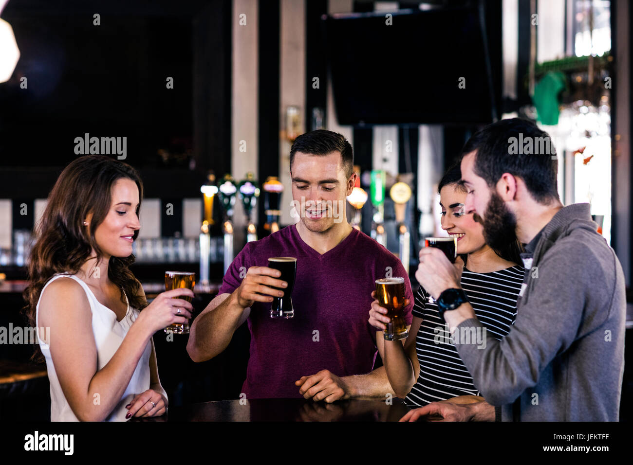 Friends having a pint Stock Photo - Alamy