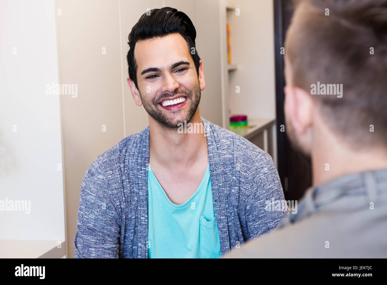 Happy gay couple talking Stock Photo - Alamy