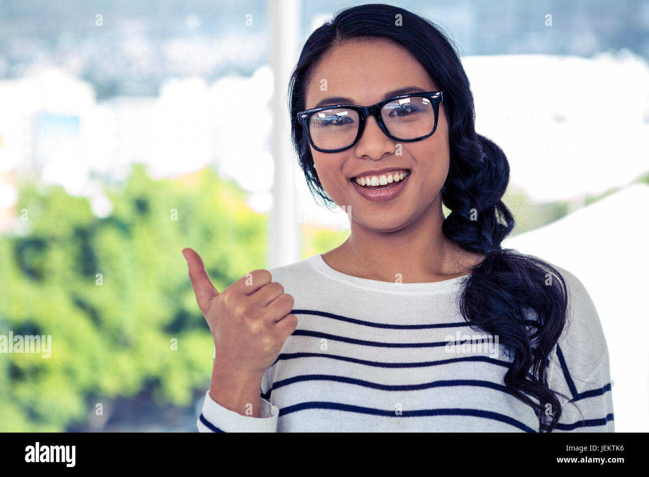Smart woman showing thumb hi-res stock photography and images - Alamy