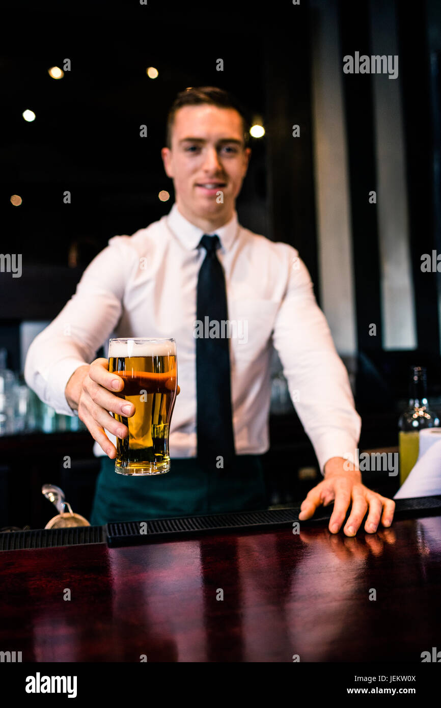 Barman serving a pint of beer Stock Photo - Alamy
