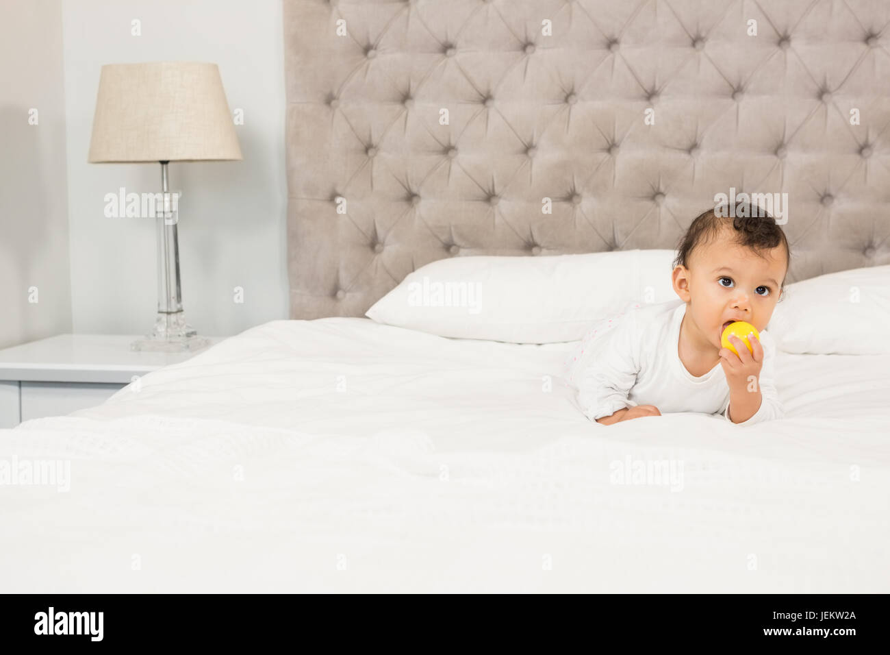 Cute baby playing with ball Stock Photo - Alamy