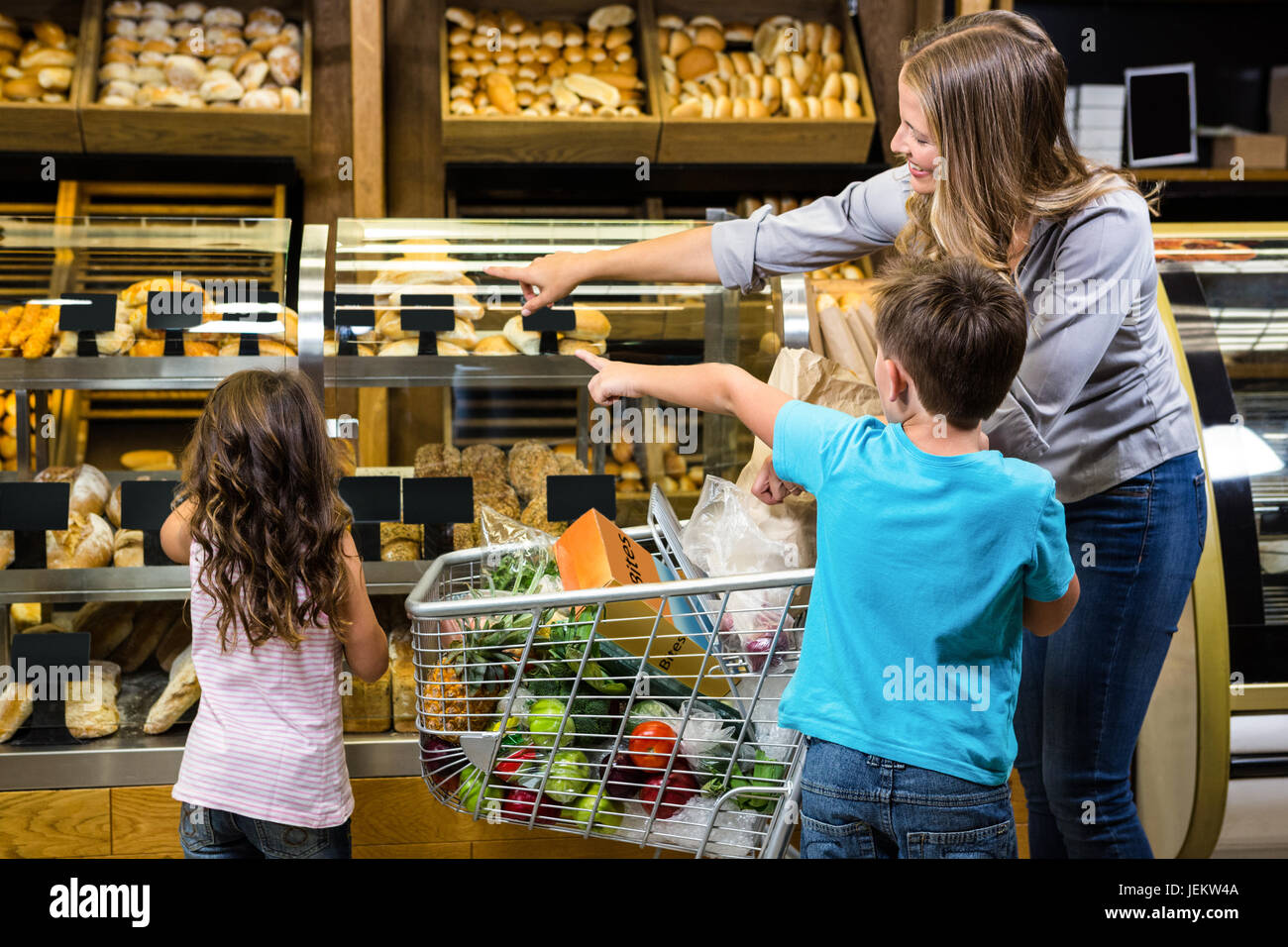 Happy family looking at bread Stock Photo - Alamy