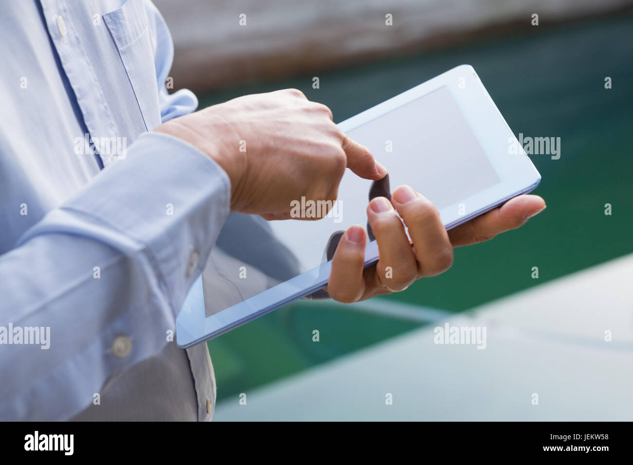 Man using tablet Stock Photo - Alamy