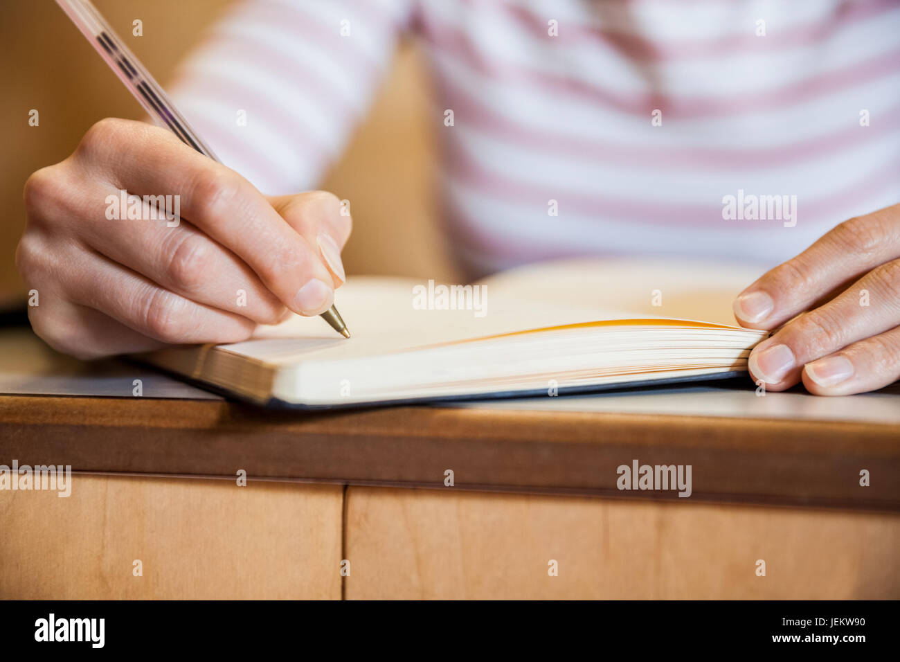 Female student writing notes hi-res stock photography and images - Alamy