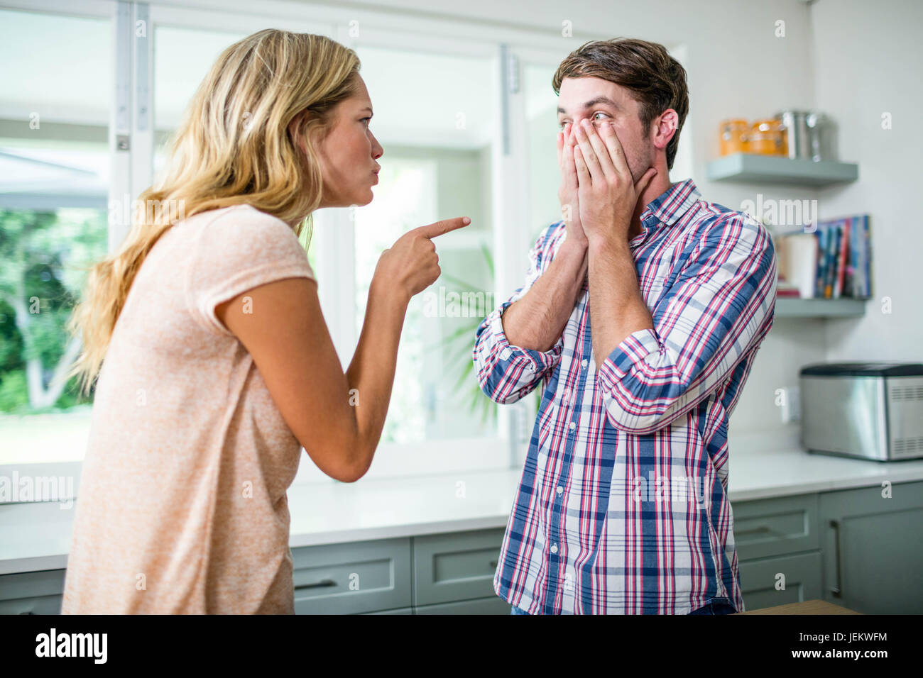 Upset couple having an argument Stock Photo - Alamy
