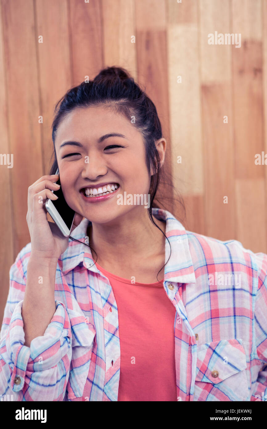 Happy Asian woman on phone call Stock Photo - Alamy