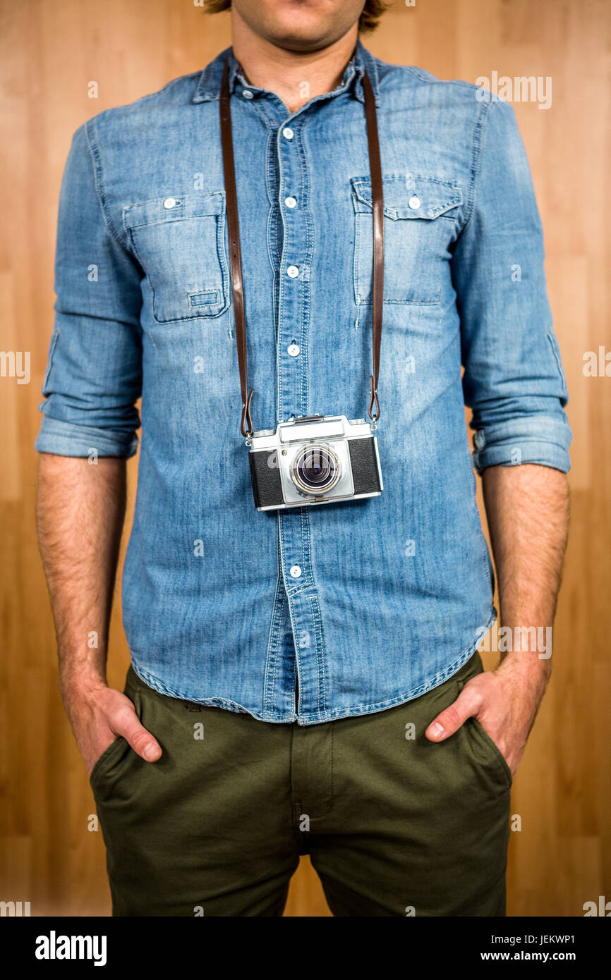 Hipster man holding digital camera Stock Photo - Alamy