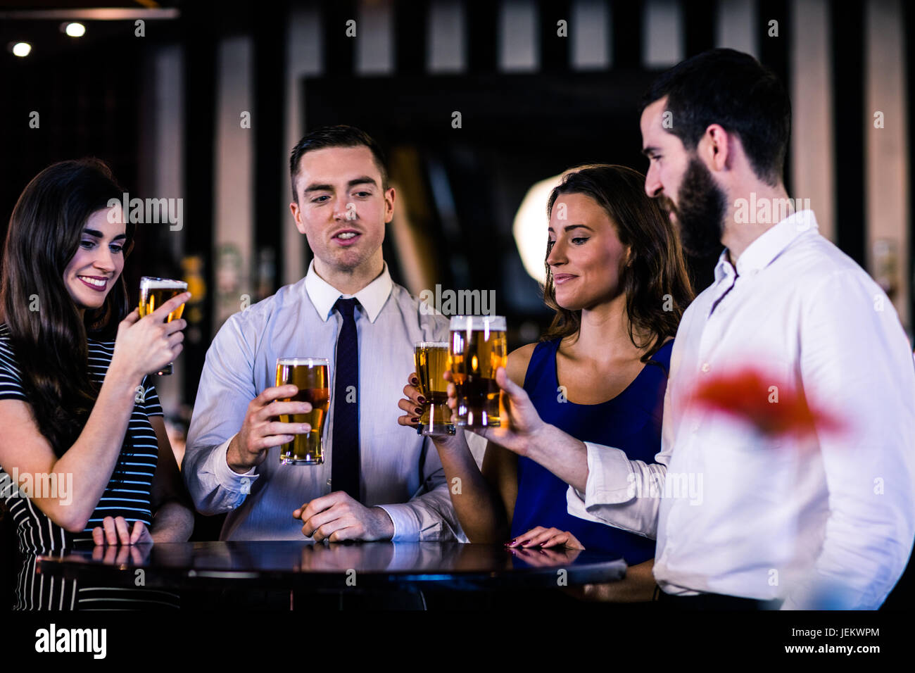 Friends talking and having a beer Stock Photo - Alamy