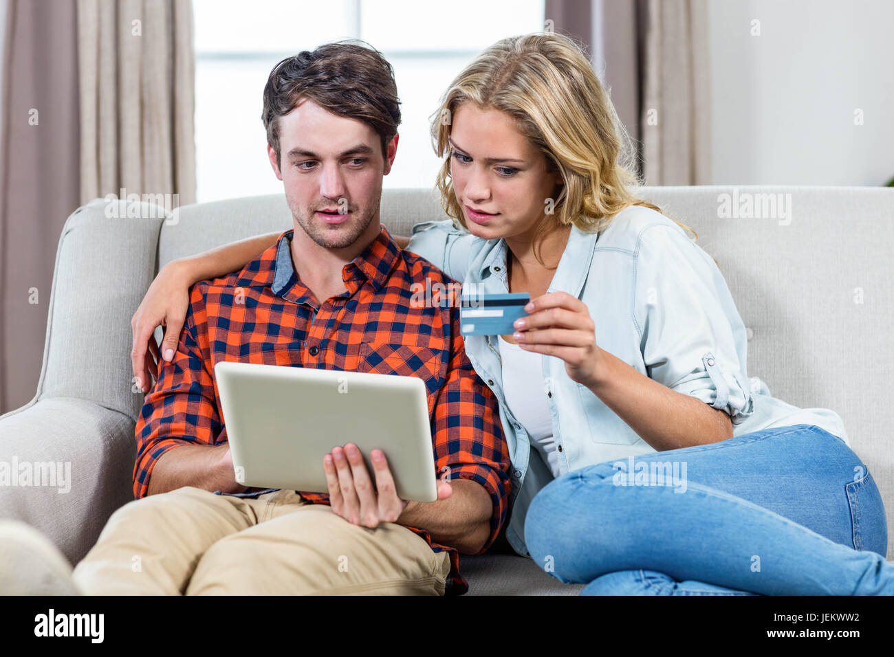 Pretty couple using credit card hi-res stock photography and images - Alamy