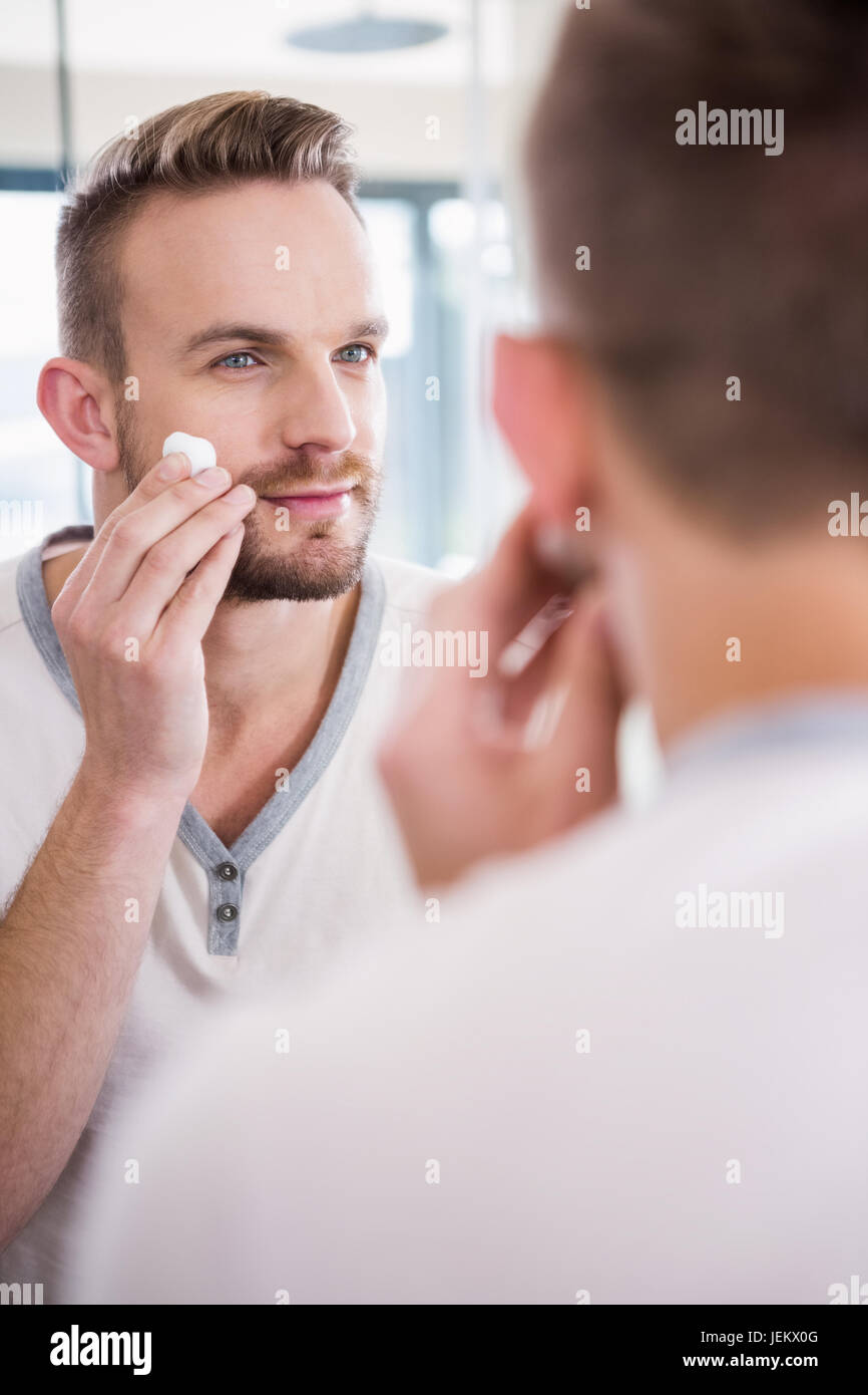 Smiling man shaving his beard Stock Photo - Alamy