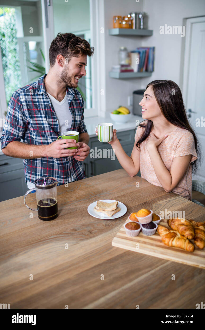 Happy couple having breakfast together Stock Photo - Alamy