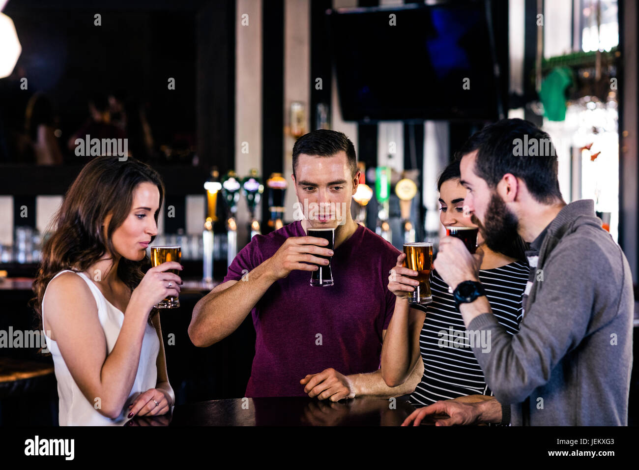 Friends having a pint Stock Photo - Alamy