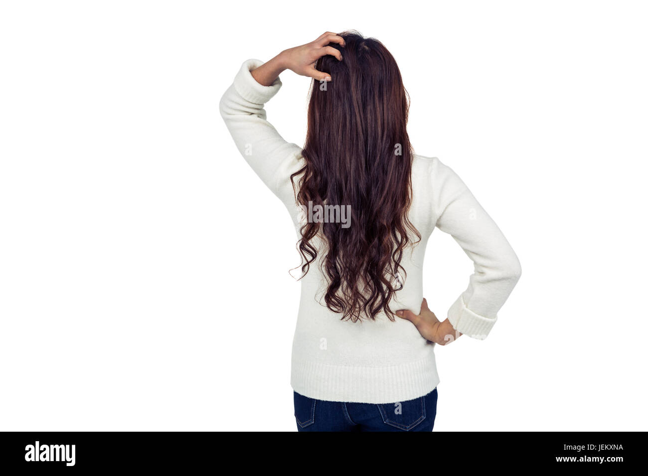 Rear view of brunette with hand on hair Stock Photo - Alamy