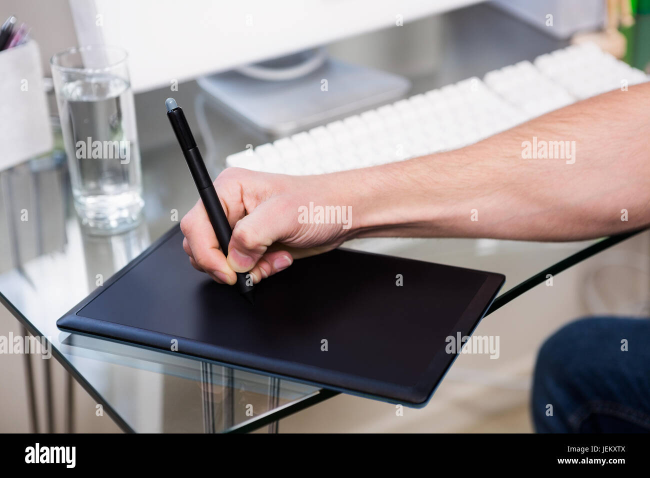 Cropped image of man using graphic tablet Stock Photo - Alamy