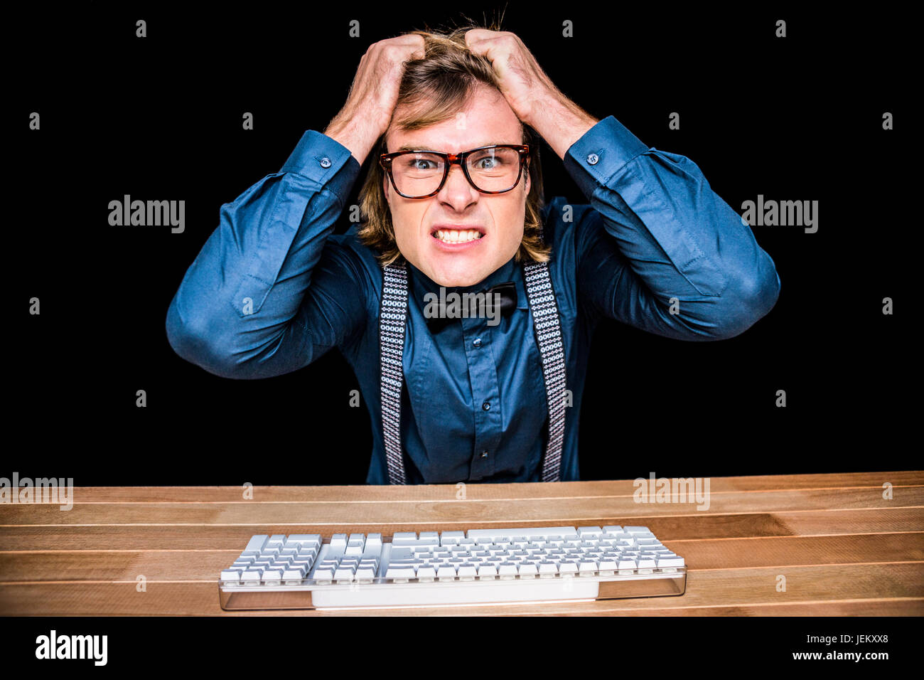 Angry hipster businessman holding his hairs Stock Photo - Alamy