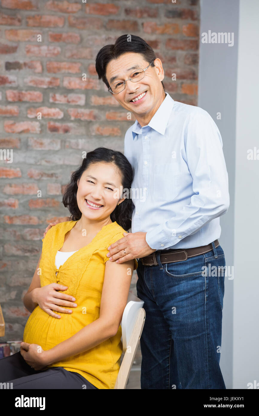 Portrait of happy expectant couple Stock Photo - Alamy
