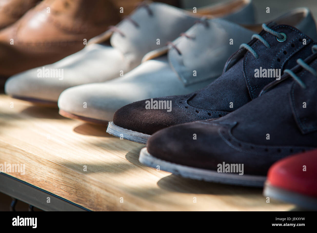 Close up on mens leather shoes in the row Stock Photo - Alamy
