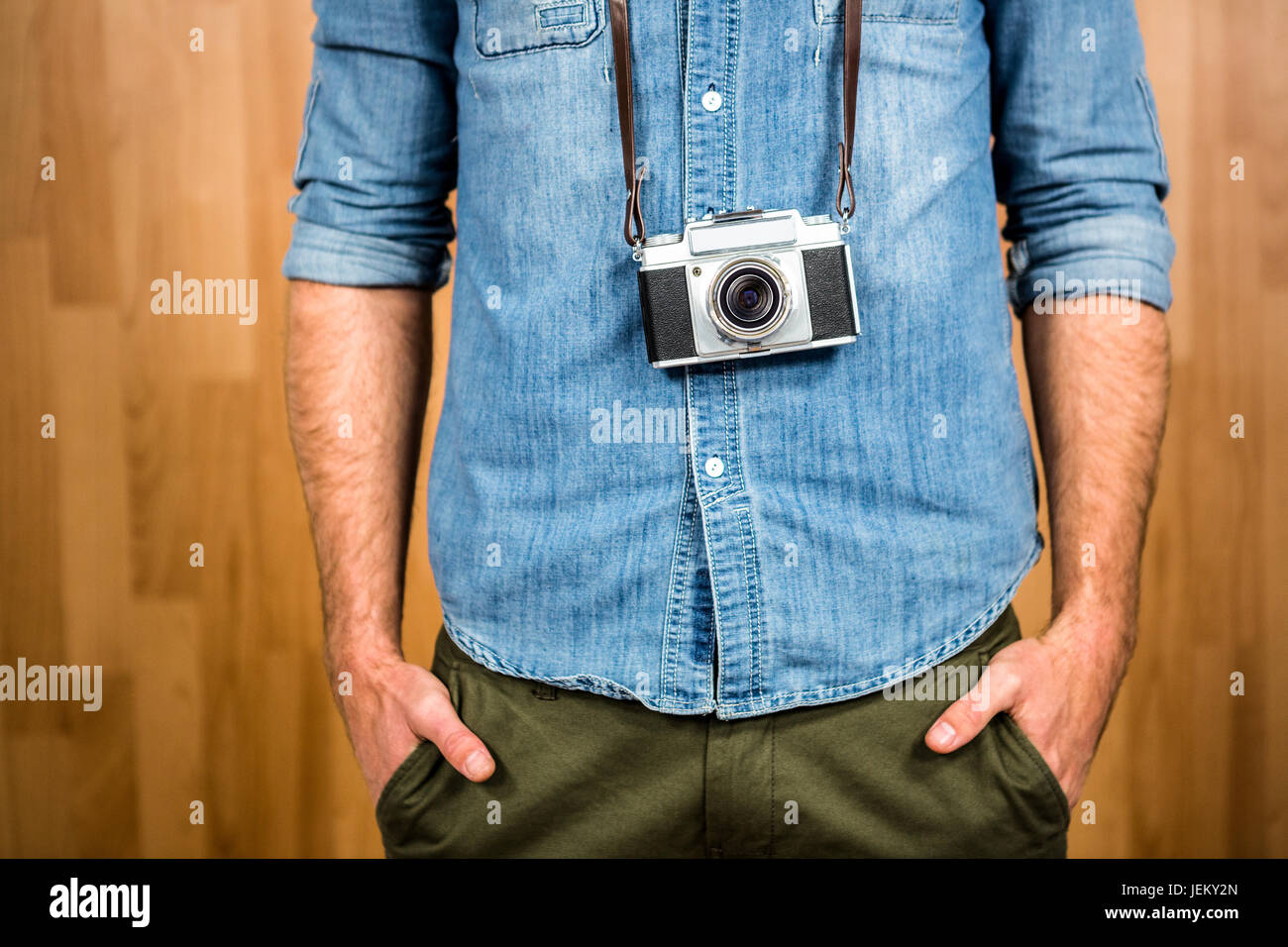 Hipster man holding digital camera Stock Photo - Alamy
