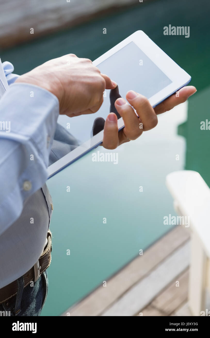 Man using tablet Stock Photo - Alamy