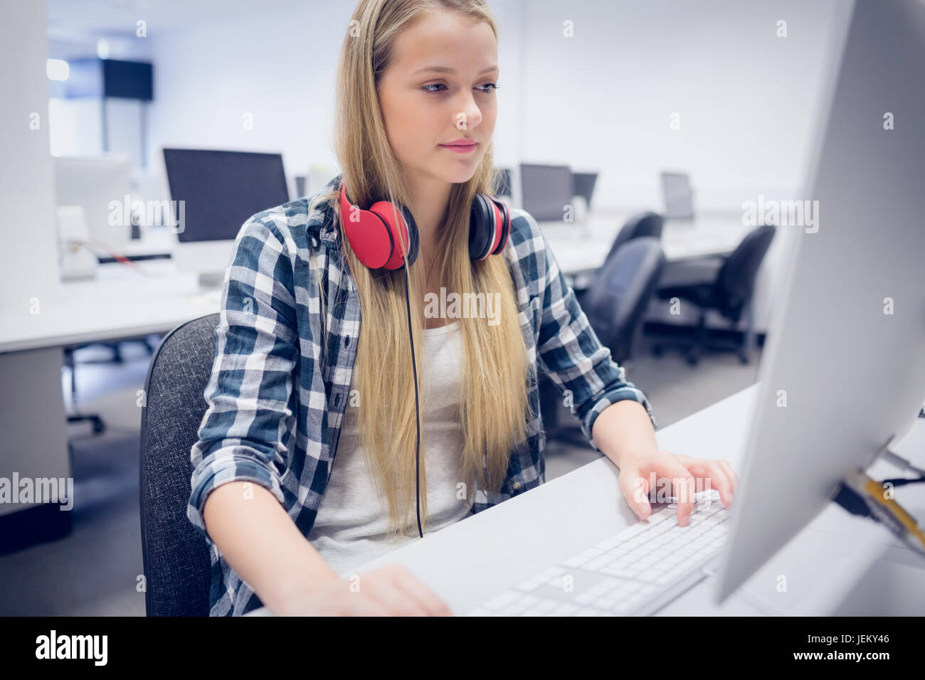 Serious student working on computer Stock Photo - Alamy