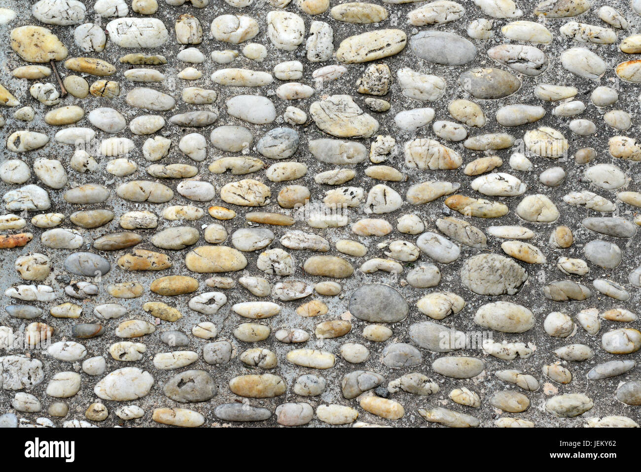 Walking path lined with stones Stock Photo - Alamy