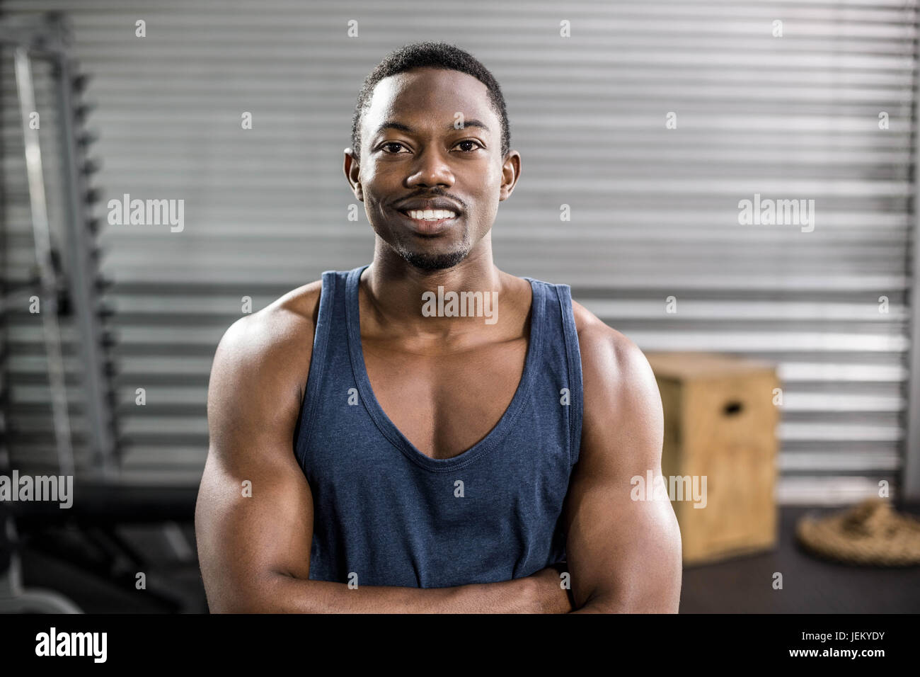 Smiling fit man posing Stock Photo - Alamy