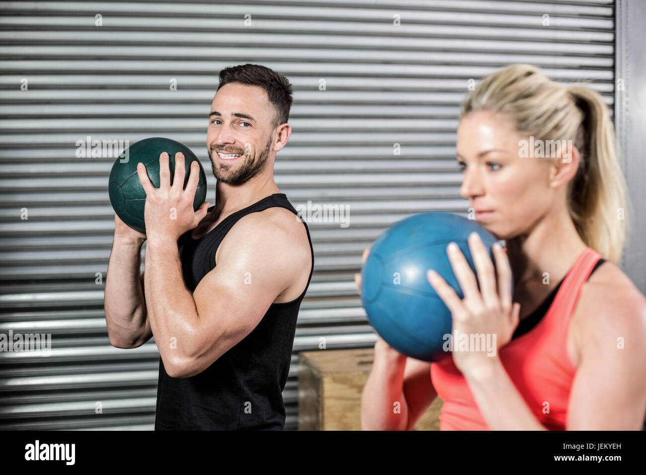 Couple doing ball exercise Stock Photo - Alamy