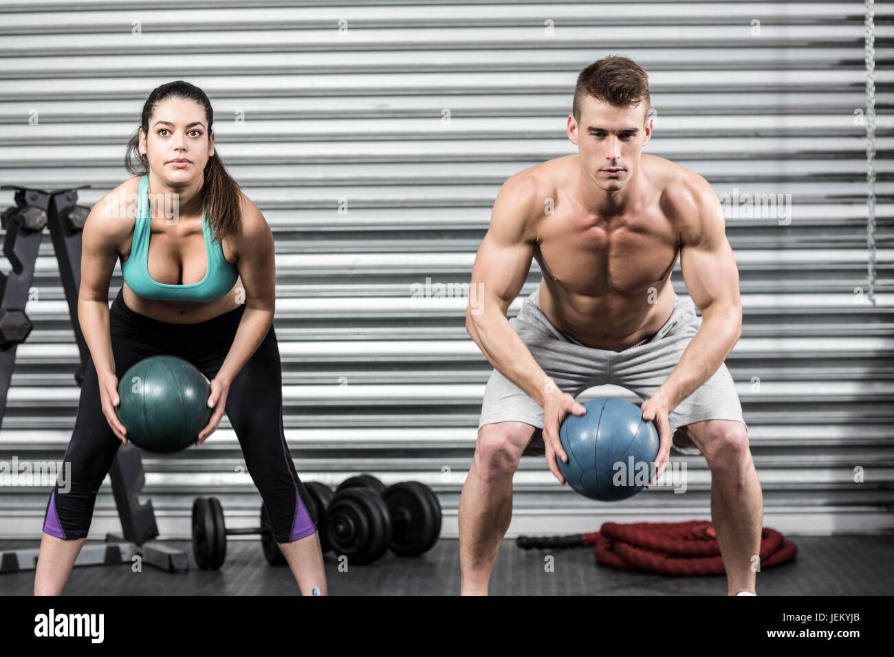 Fit couple doing ball exercise Stock Photo - Alamy