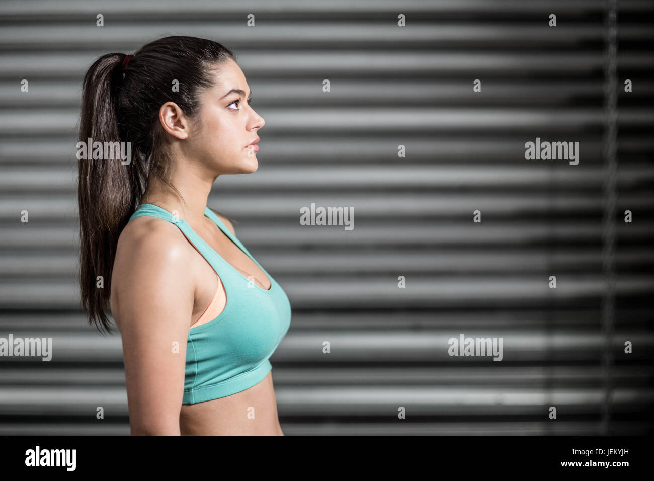 Portrait of fit woman looking up Stock Photo - Alamy